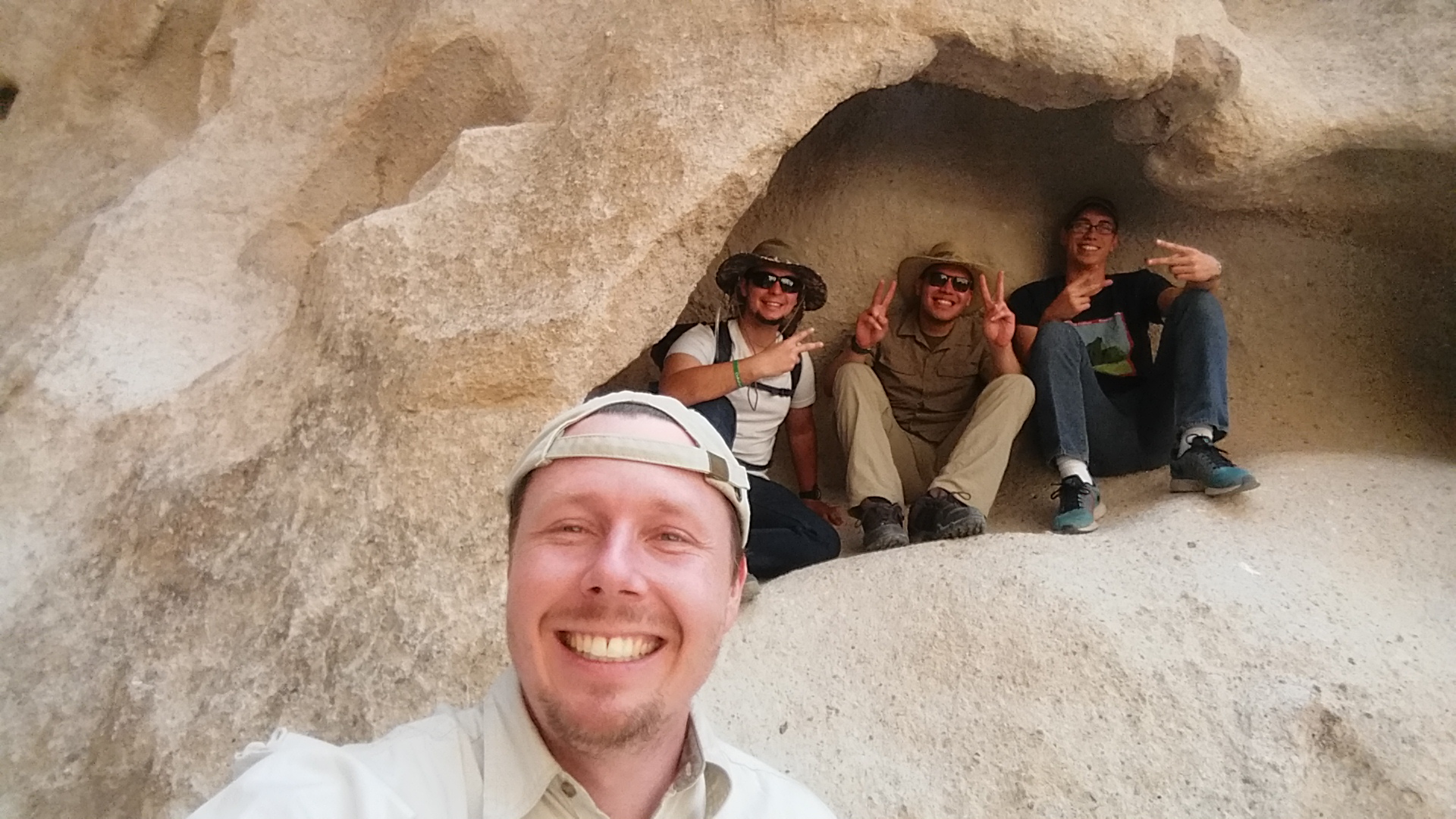 prof benker with students inside hole | Sonya Christian's Blog